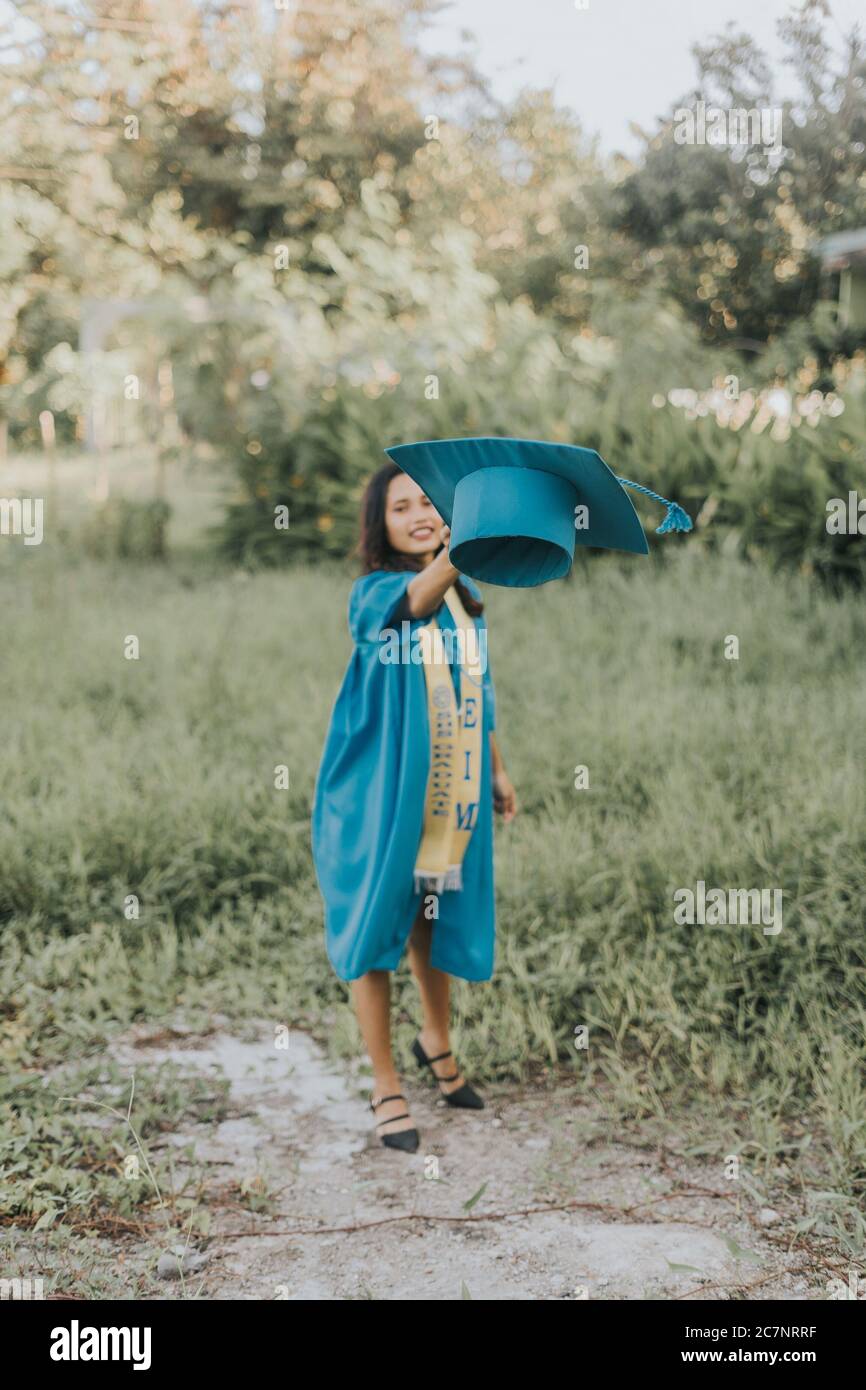 Portrait of a Filipino Woman Graduation Throwing a Graduation Cap Stock ...
