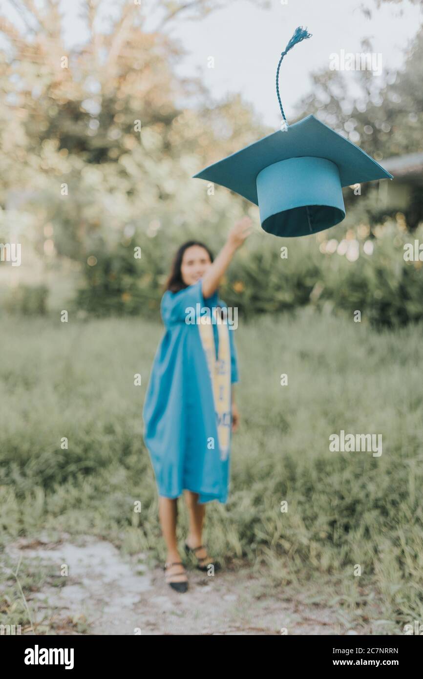 Portrait of a Filipino Woman Graduation Throwing a Graduation Cap Stock ...