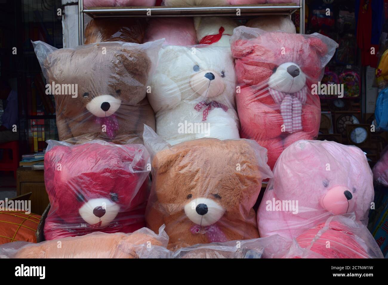 Colorful toy bears in plastic bags in the market Stock Photo - Alamy