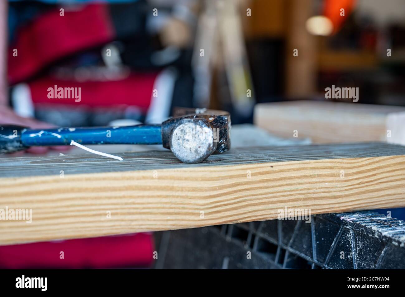 A off center strike of a hammer bendt a nail Stock Photo - Alamy