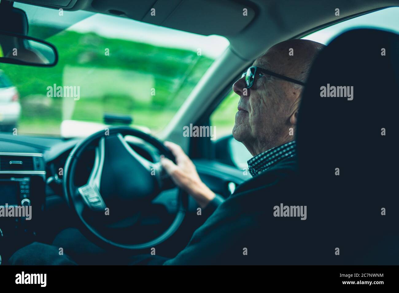 A senior man is driving his car Stock Photo - Alamy