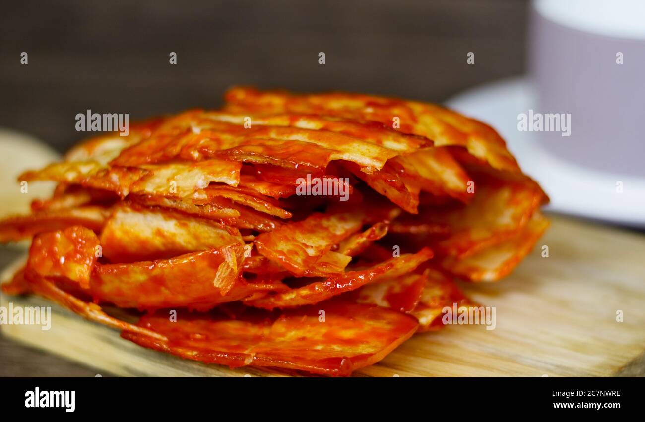 Balado Spicy Chips (cassava crackers) on white background Stock Photo ...