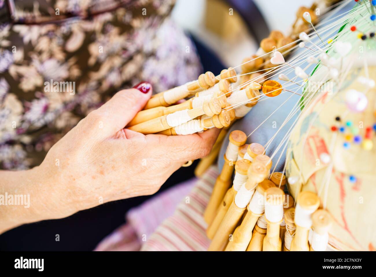 Bobbin lacemaking hi-res stock photography and images - Alamy