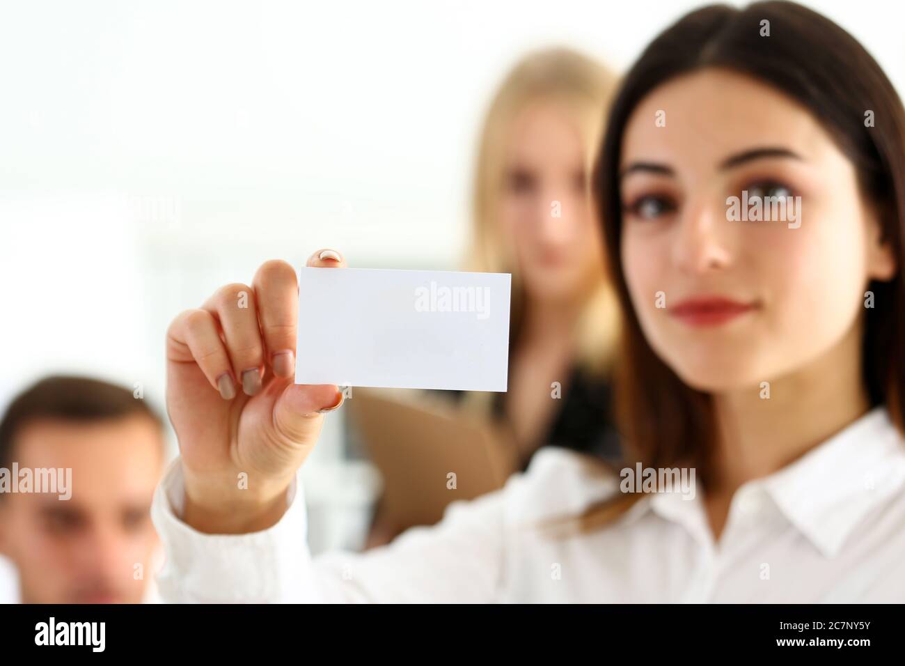 Female hand in suit give blank calling card to visitor Stock Photo - Alamy
