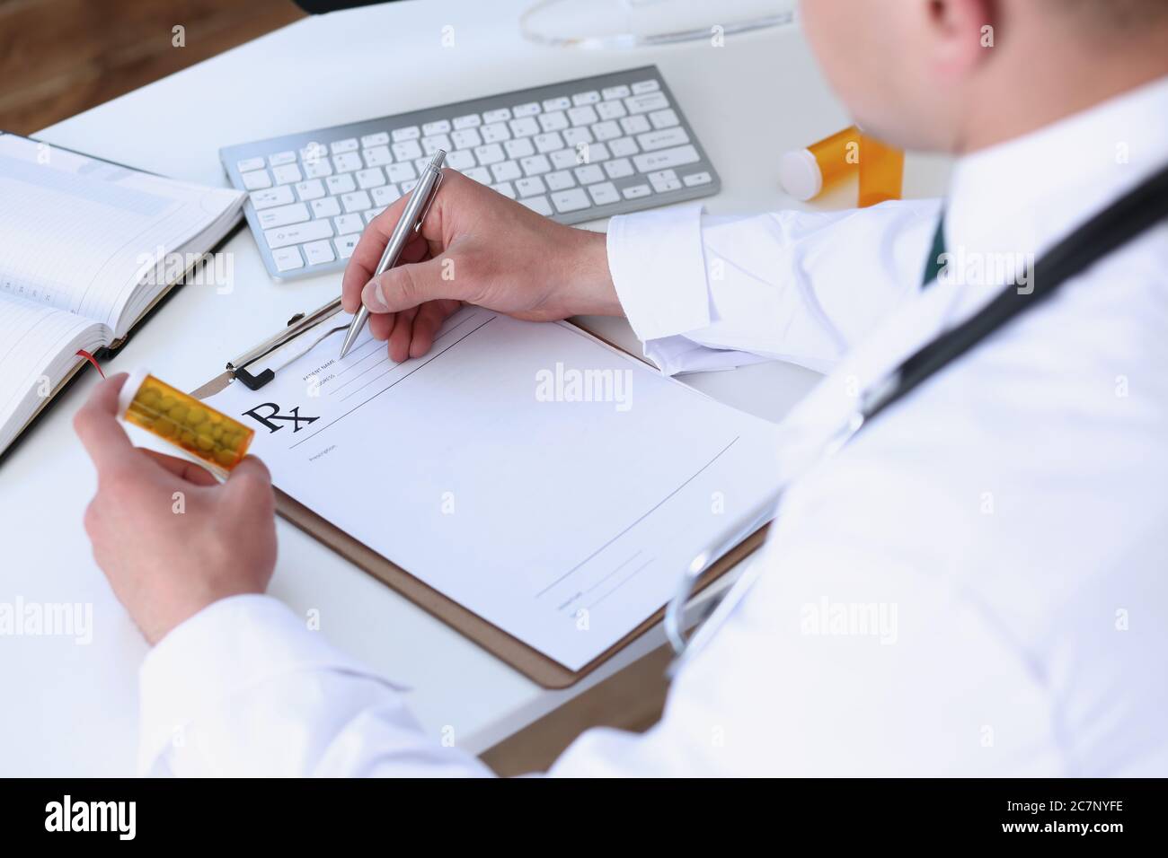 Male medicine doctor hand hold jar of pills Stock Photo - Alamy