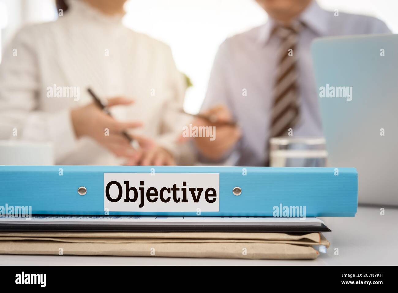 Objective document folder with staff and manager in meeting room Stock ...