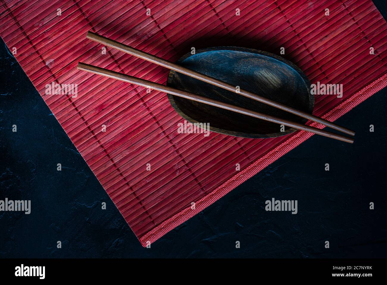 Asian table setting with chopsticks on stone background with copy space ...