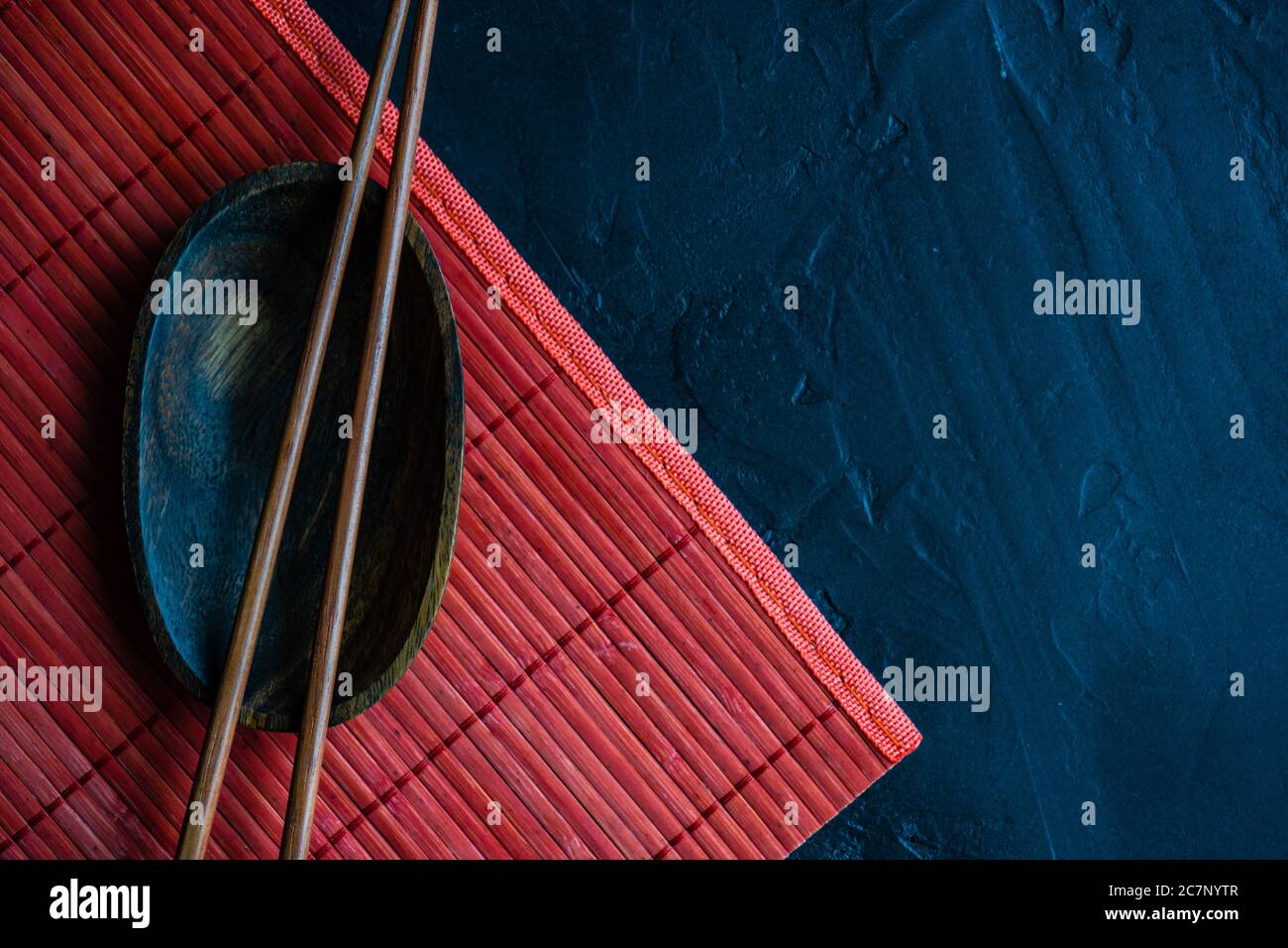 Asian table setting with chopsticks on stone background with copy space ...