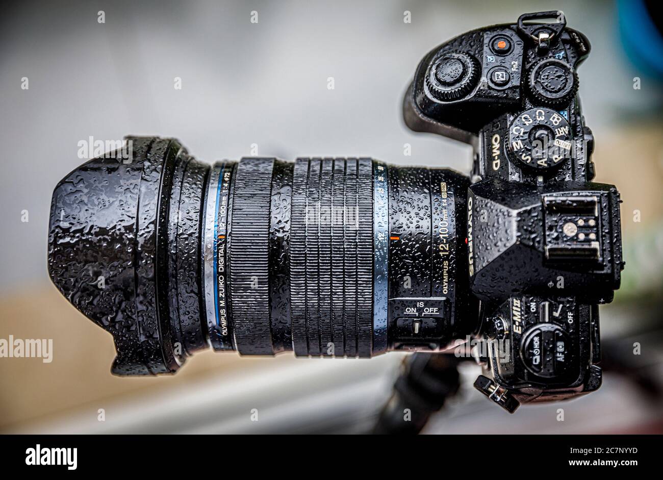 Olympus camera full of raindrops from the rain Stock Photo - Alamy