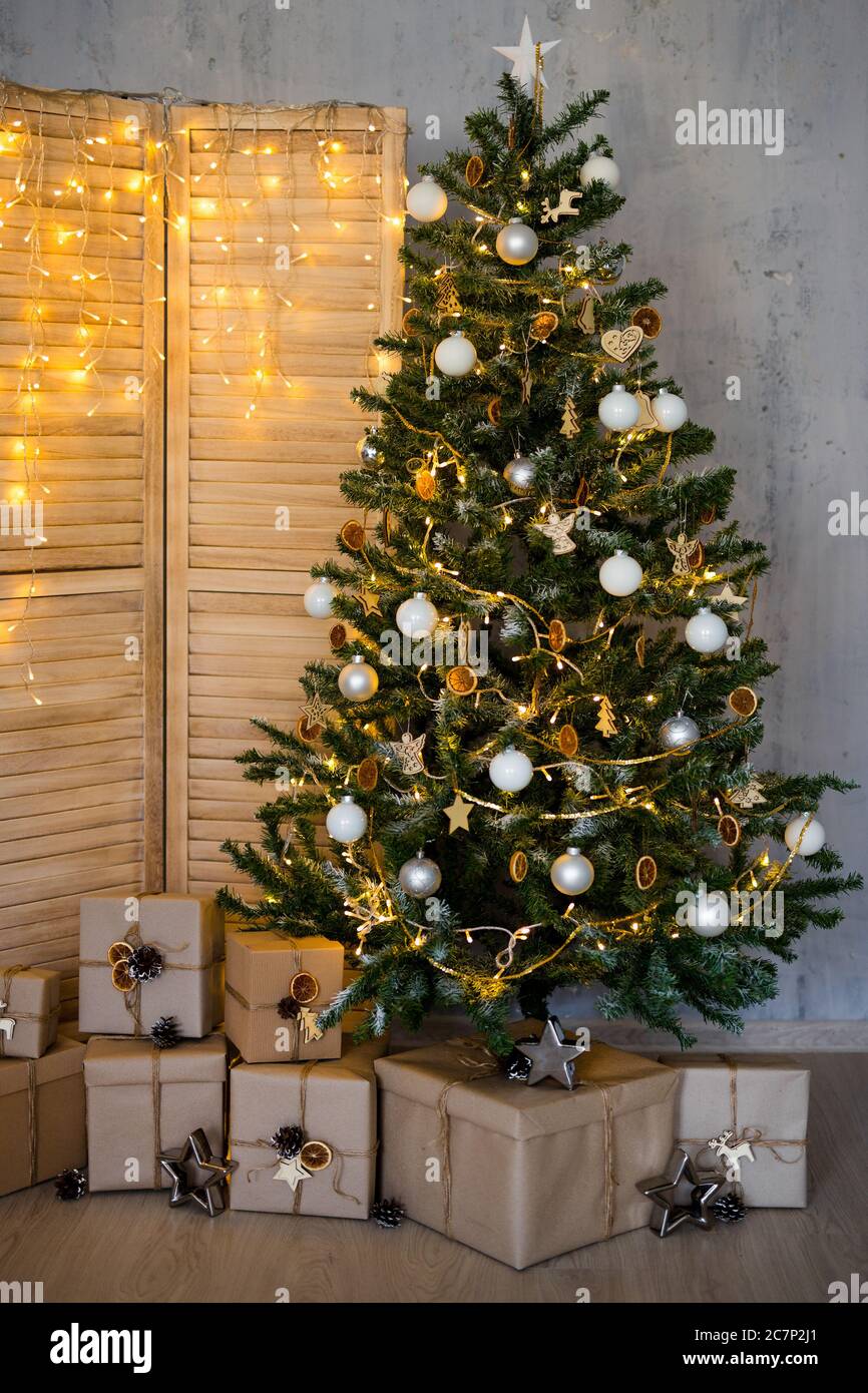 Christmas and new year background - christmas tree, heap of gifts and ...