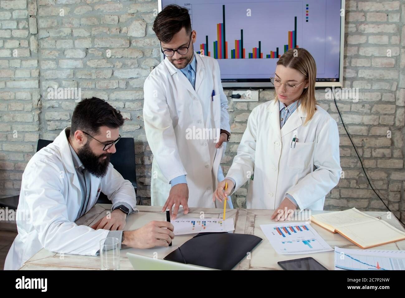 Group of doctors discussing possible solutions for resolving Covid-19 ...