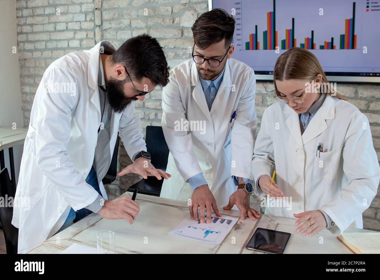 Group of doctors discussing possible solutions for resolving Covid-19 ...