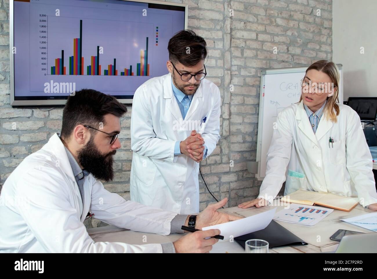 Group of doctors discussing possible solutions for resolving Covid-19 ...