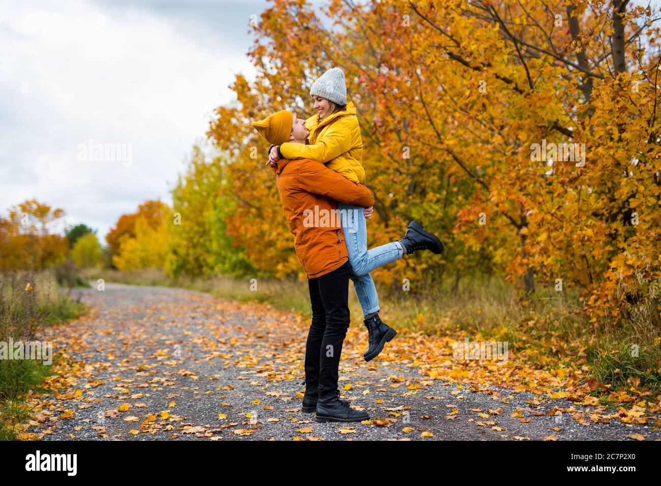 portrait of cute couple walking in autumn forest or park Stock Photo ...