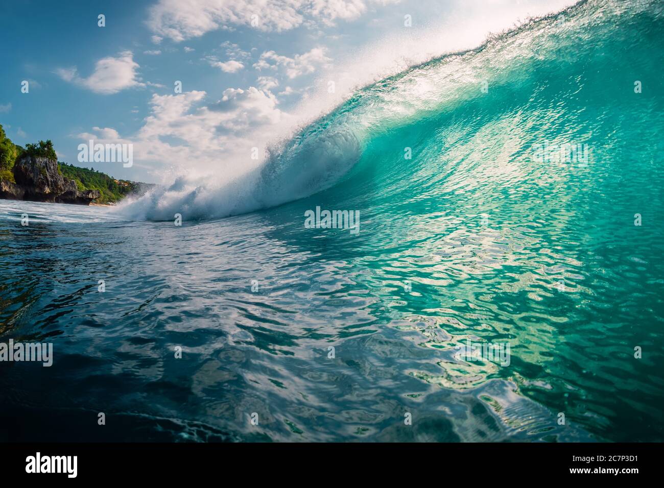 Surfing barrel wave in ocean. Breaking wave and sun light Stock Photo ...