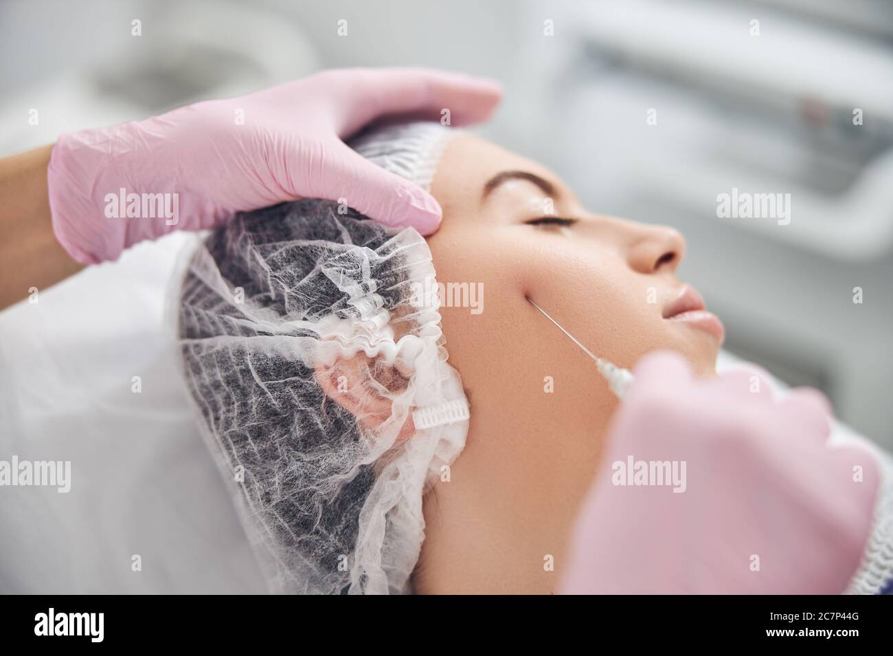 Appearance improvement during beauty procedure in clinical room Stock ...