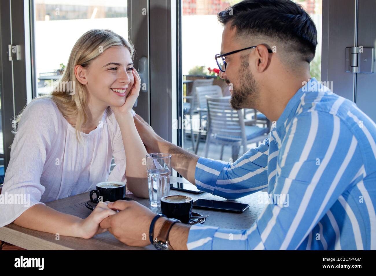 Beautiful romantic couple drinking coffee in a restaurant Stock Photo ...