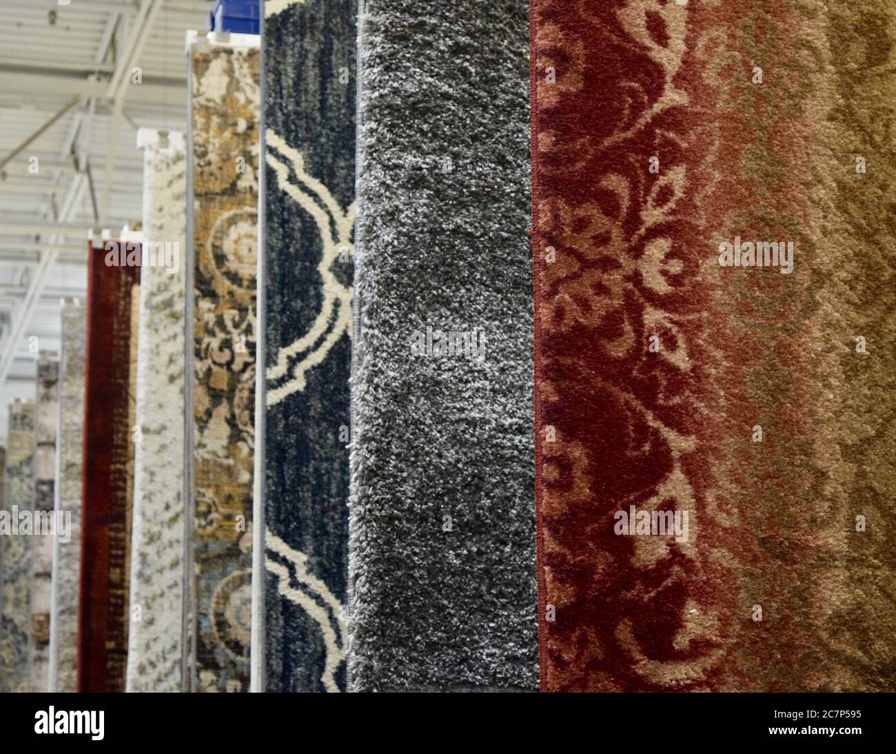 Side view of decorative rug patterns in an interior design store Stock ...
