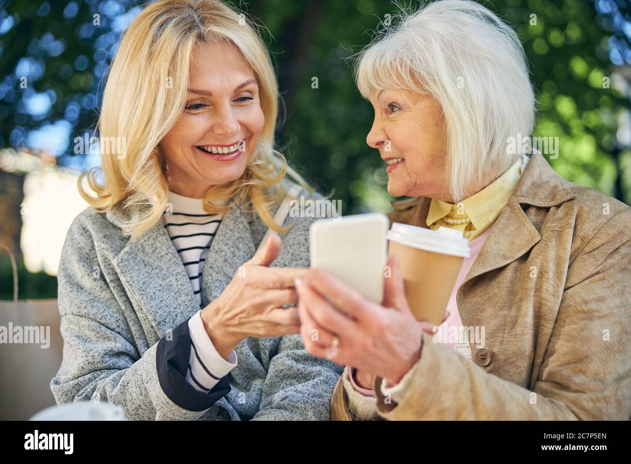 Portrait of happy beautiful ladies smiling outdoors Stock Photo - Alamy
