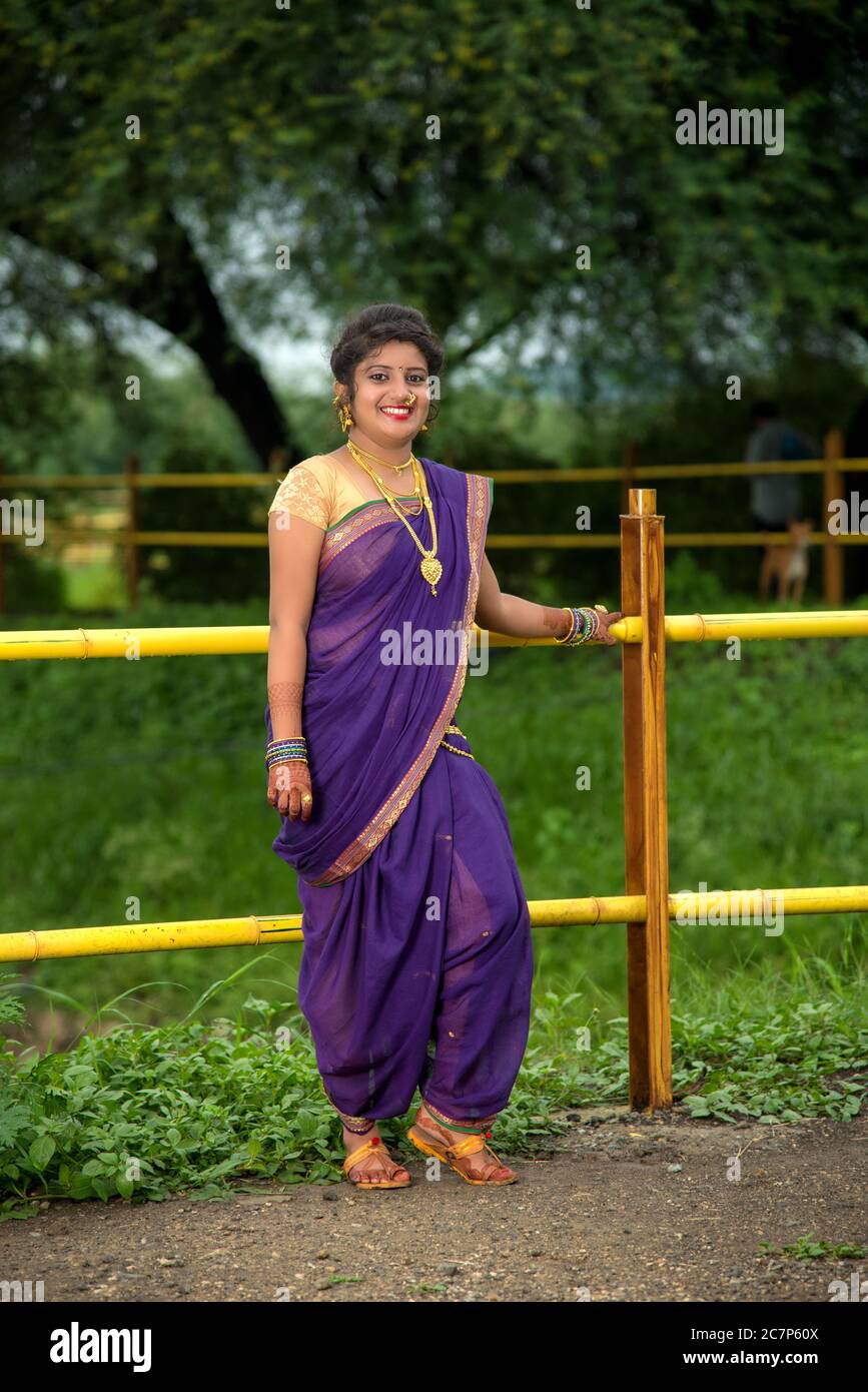 Beautiful Indian young girl in Traditional Saree posing outdoors Stock ...