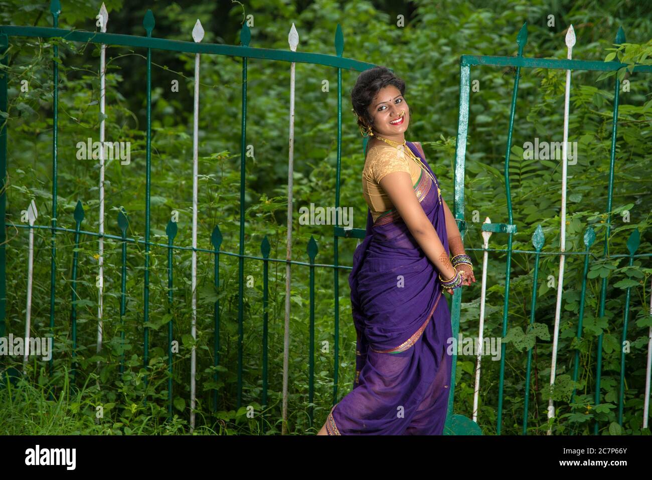 Beautiful Indian young girl in Traditional Saree posing outdoors Stock ...