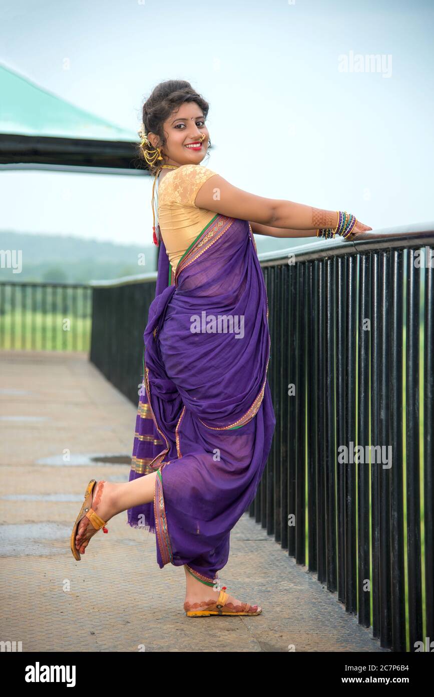 Beautiful Indian Young Girl In Traditional Saree Posing Outdoors Stock