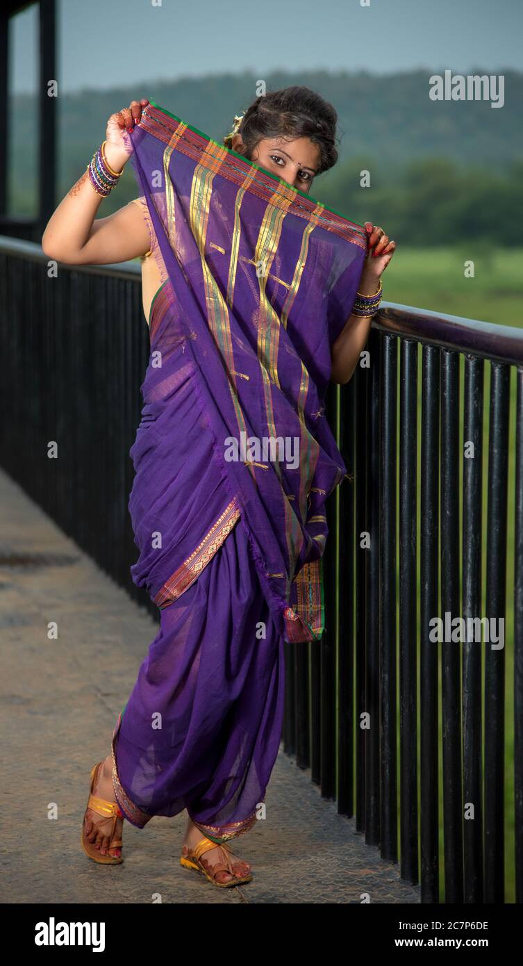 Beautiful Indian young girl in Traditional Saree posing outdoors Stock ...