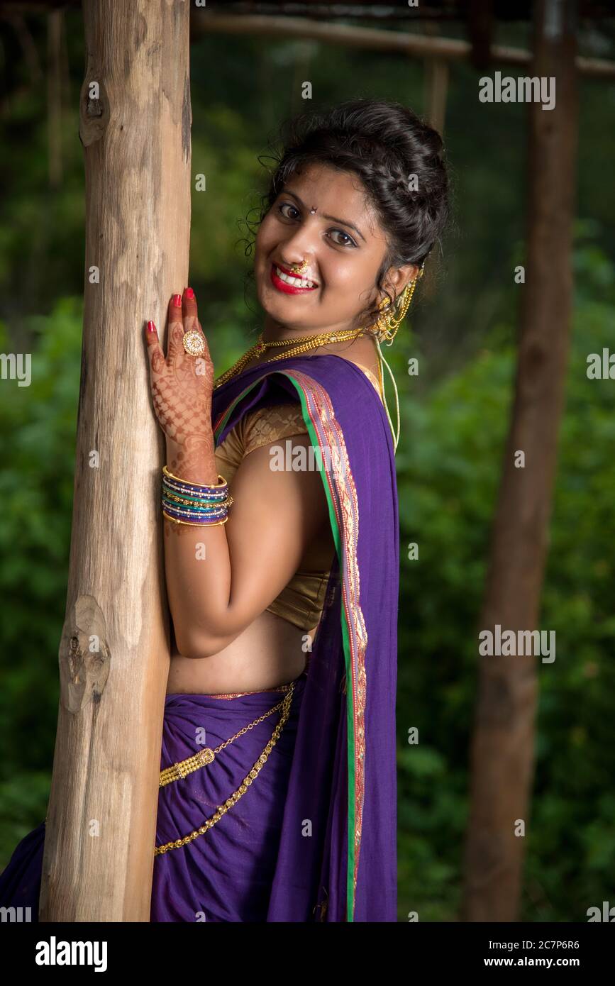 Beautiful Indian young girl in Traditional Saree posing outdoors Stock ...
