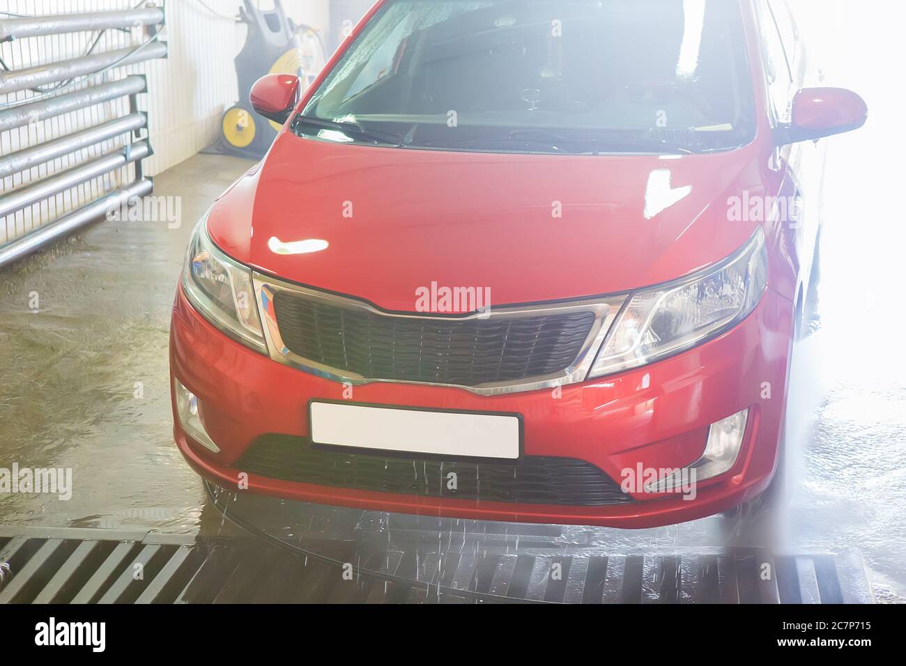 new pure red car at the car wash Stock Photo - Alamy
