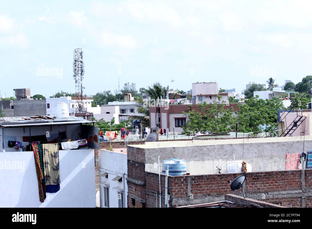 residential buildings and houses in city, Indian street sky background ...