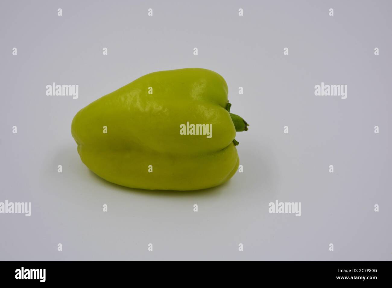 One bell pepper, not hot, sweet crunchy pepper located on a white ...