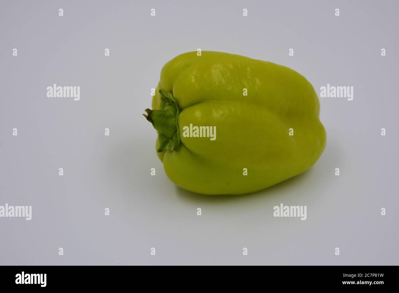 One bell pepper, not hot, sweet crunchy pepper located on a white ...