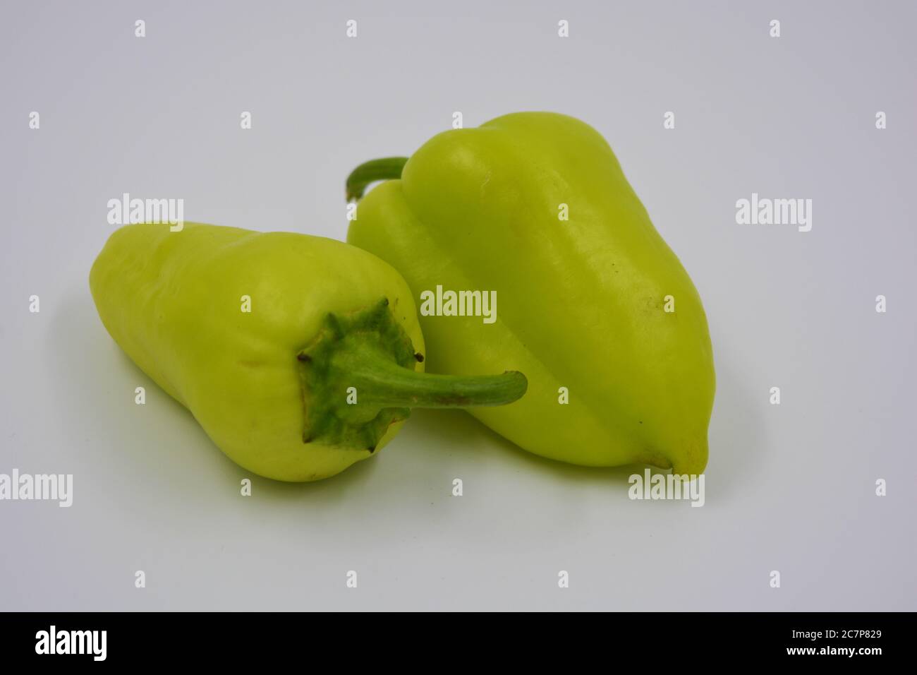 Two bell peppers, not hot, sweet crunchy peppers are arranged on a ...