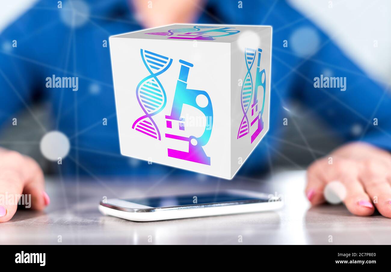 Smartphone with dna technology concept between hands of a woman in ...