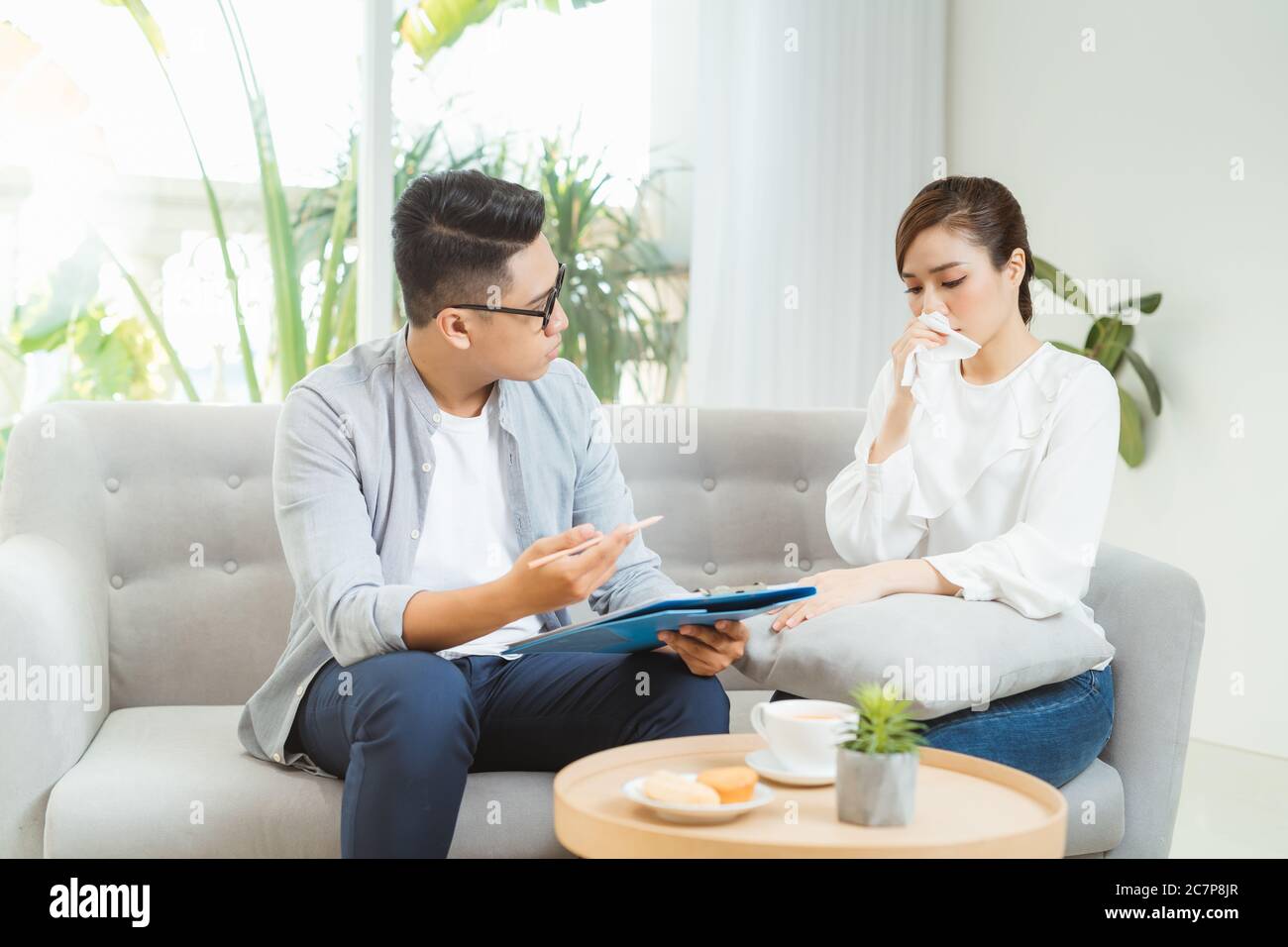 Psychological treatment. Professional psychologist helping his patient ...