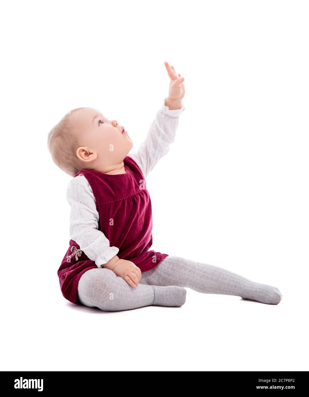 cute baby girl pointing up isolated on white background Stock Photo - Alamy