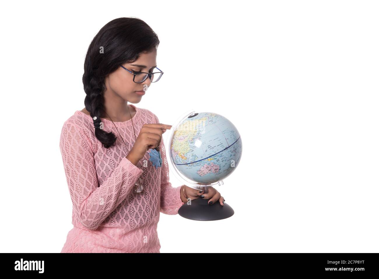 Beautiful Girl holding a world globe isolated on a white background ...