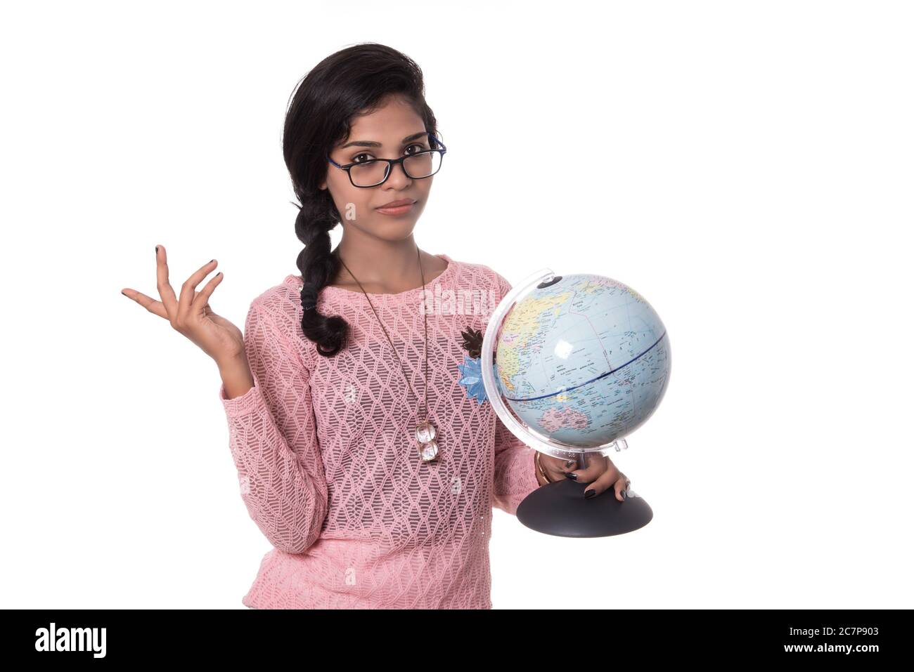 Beautiful Girl holding a world globe isolated on a white background ...