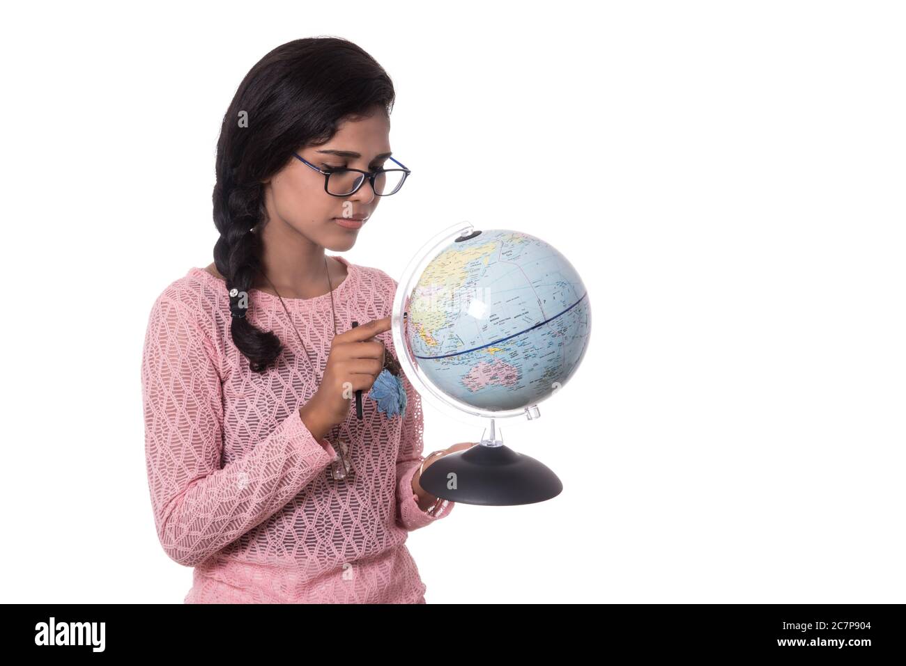 Beautiful Girl holding a world globe isolated on a white background ...