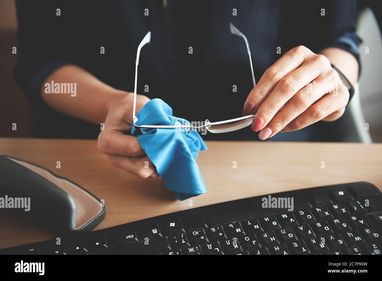 Mature woman in pain wearing a surgical collar on her neck ,working on ...