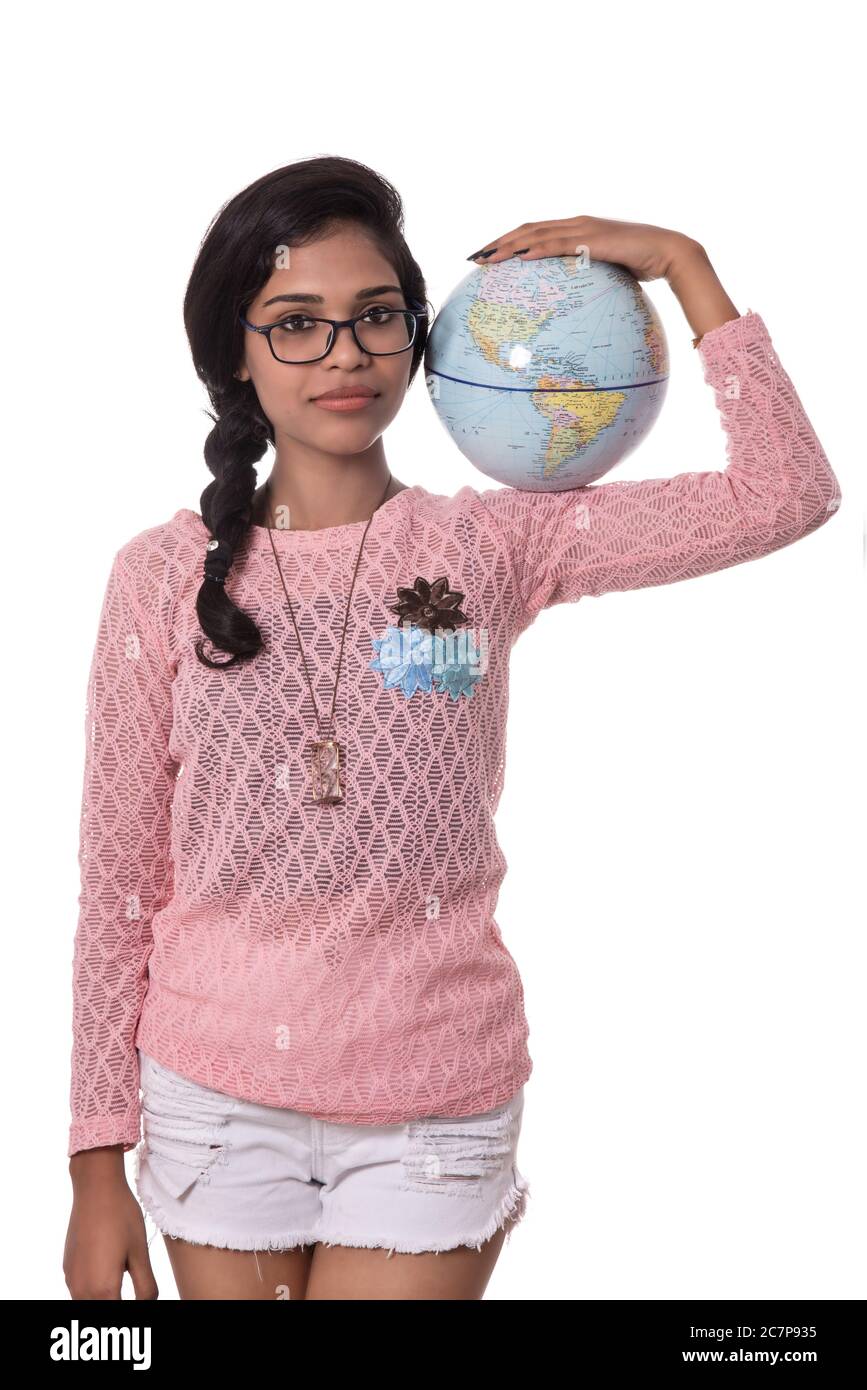 Beautiful Girl holding a world globe isolated on a white background ...