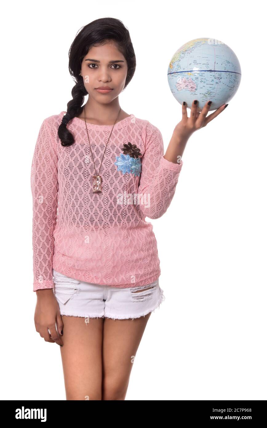 Beautiful Girl holding a world globe isolated on a white background ...