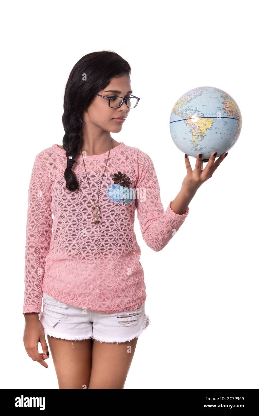 Beautiful Girl holding a world globe isolated on a white background ...