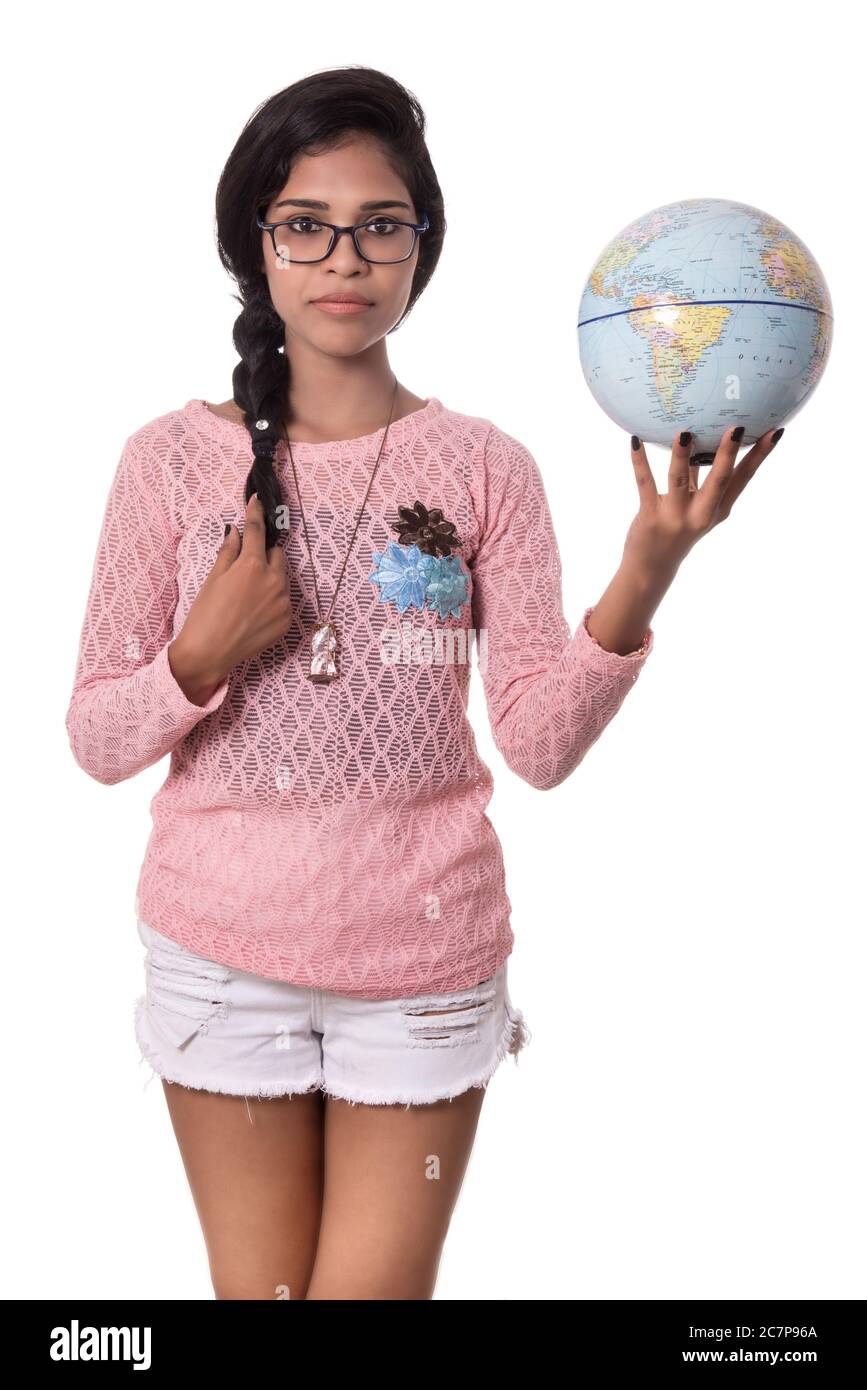 Beautiful Girl holding a world globe isolated on a white background ...