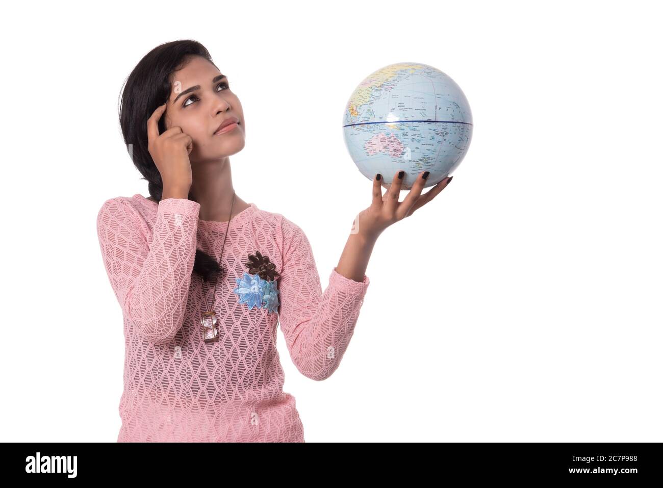 Beautiful Girl holding a world globe isolated on a white background ...