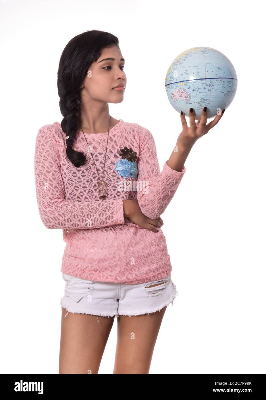 Beautiful Girl holding a world globe isolated on a white background ...