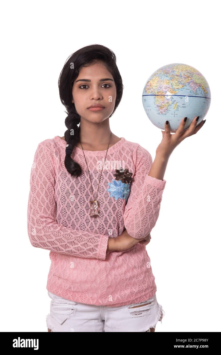Beautiful Girl holding a world globe isolated on a white background ...