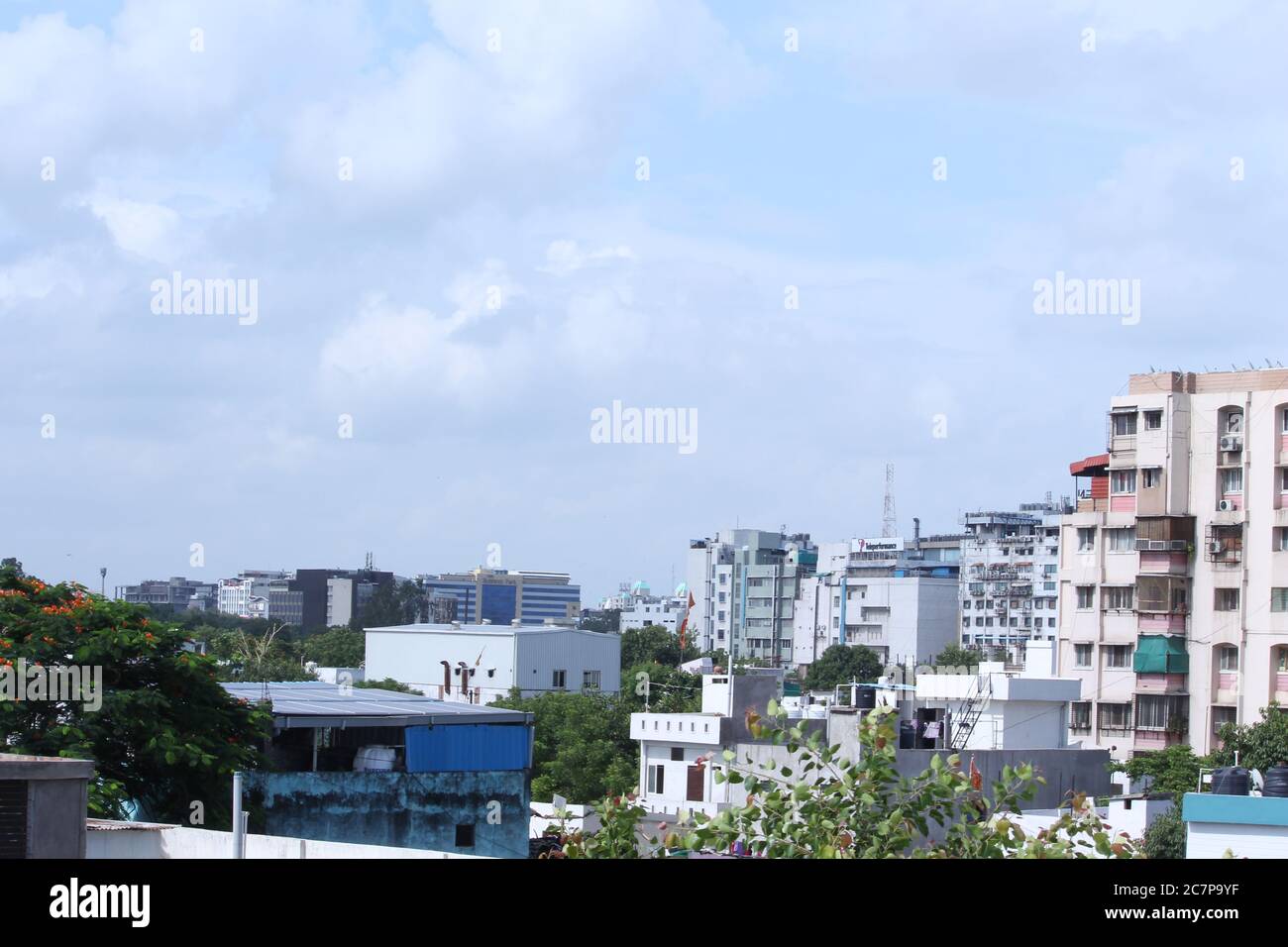 residential buildings and houses in city, Indian street sky background ...
