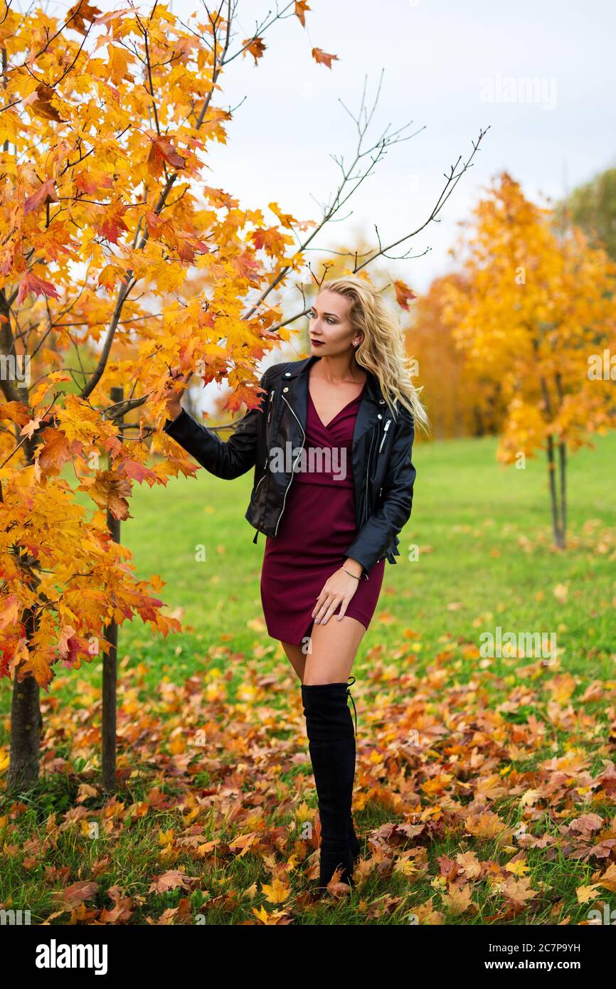young beautiful woman walking in autumn park Stock Photo - Alamy