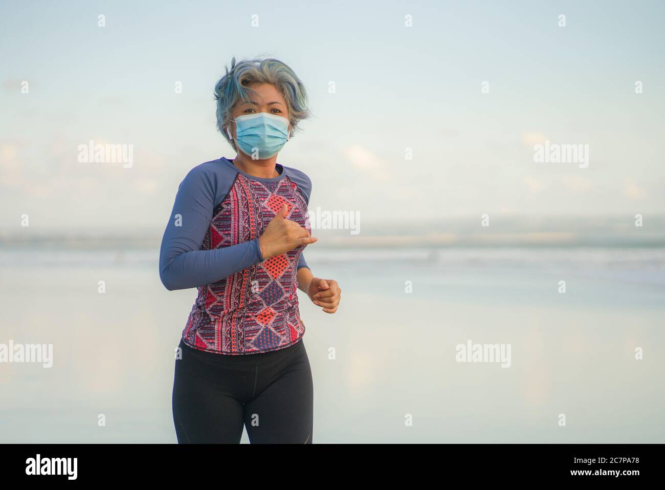 Woman Running On Beach Senior High Resolution Stock Photography and ...